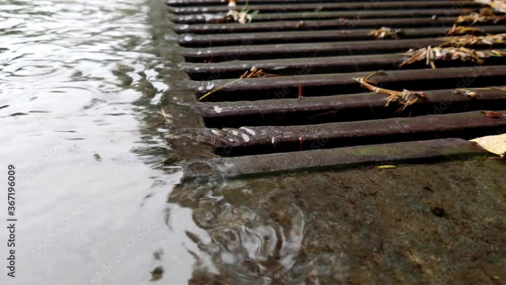 Rain falling on pavement Rain water drop falling to the floor. The rain ...