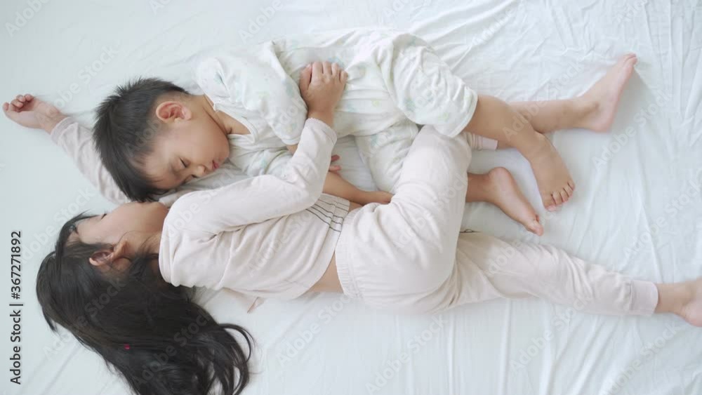 Asian Sibling Of Sister And Brother Are Sleeping Together On The White