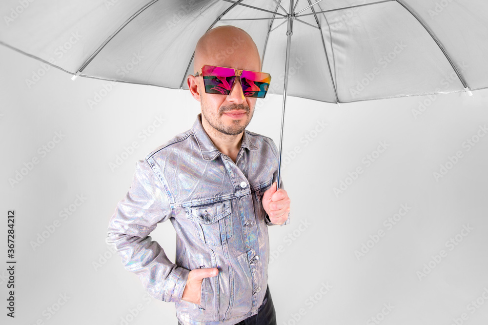 Handsome caucasian man without hair in grey shirt, black leather ...