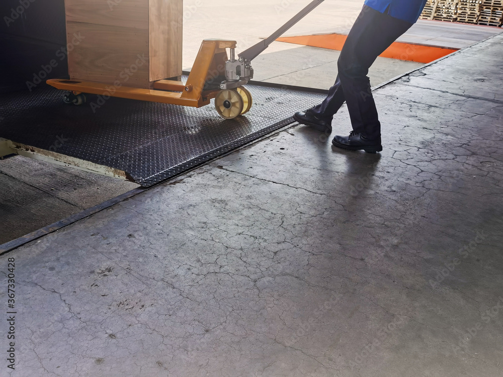 Worker driving forklift loading and unloading shipment carton boxes and ...