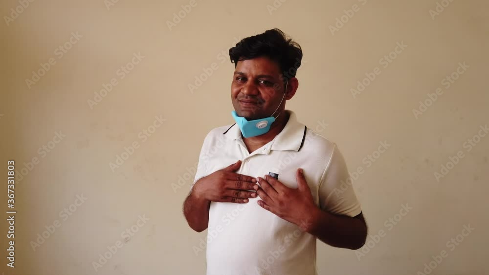 medium mid shot portrait of an asian male wearing a face mask for ...