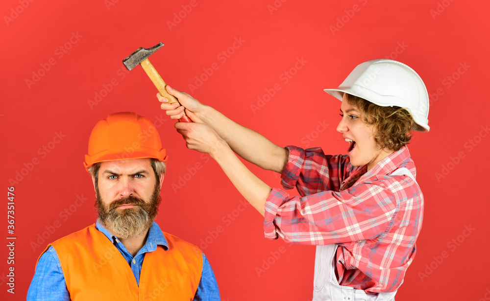 Couple making repair at home. Man and woman wear safety helmet. Home ...