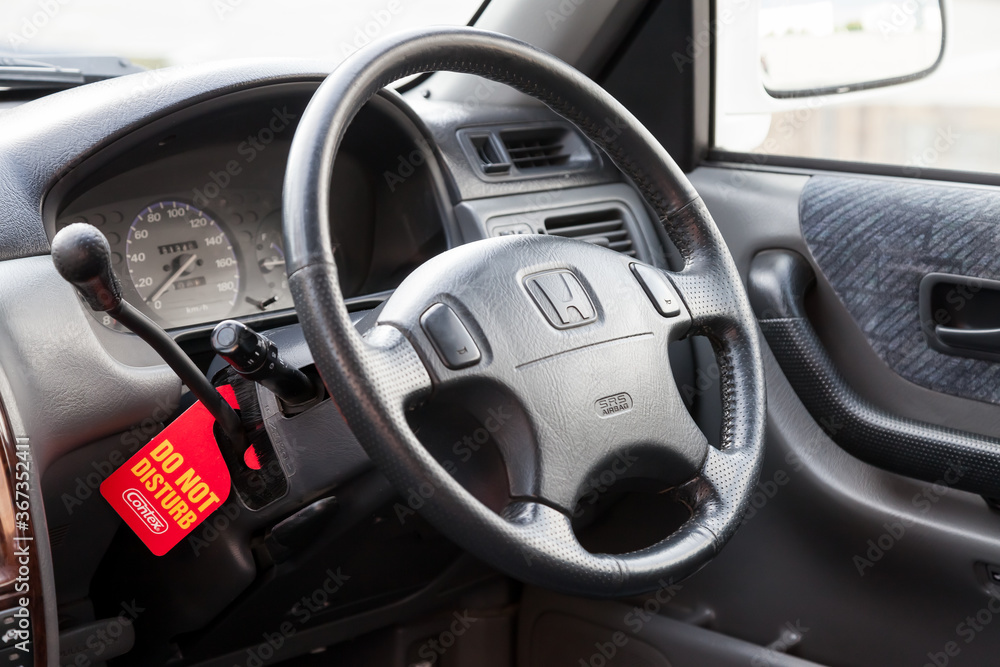 Interior of a Honda car inside with a view of the steering wheel and ...