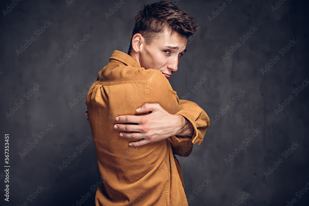 Back view of man clenched hands on dark background Stock Photo | Adobe ...