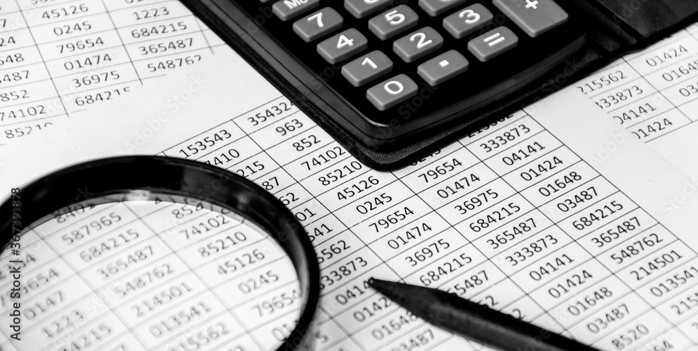 Business concept with magnifying glass, calculator and documents Stock ...