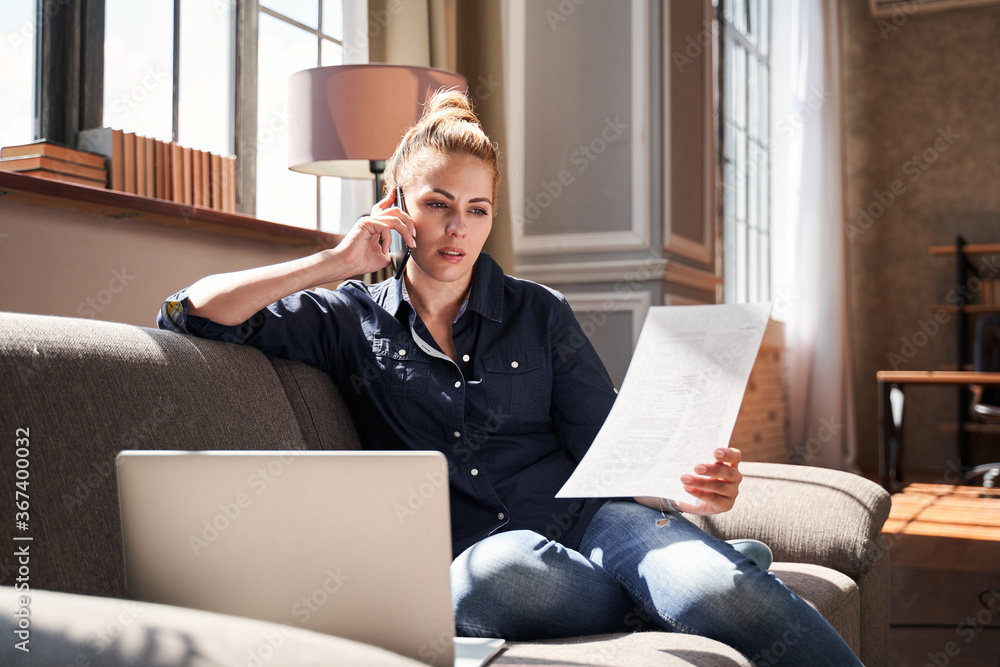 Serious teacher checking her timetable and frowning Stock Photo | Adobe ...