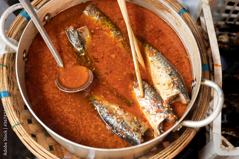 Vietnamese street food, a spicy fish stew in a Saigon market. Stock ...