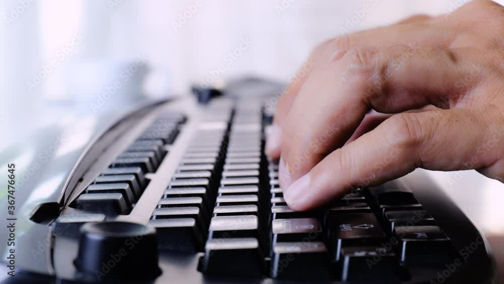 4K Close up Man hands type ona keyboard working at home. Hands touch ...