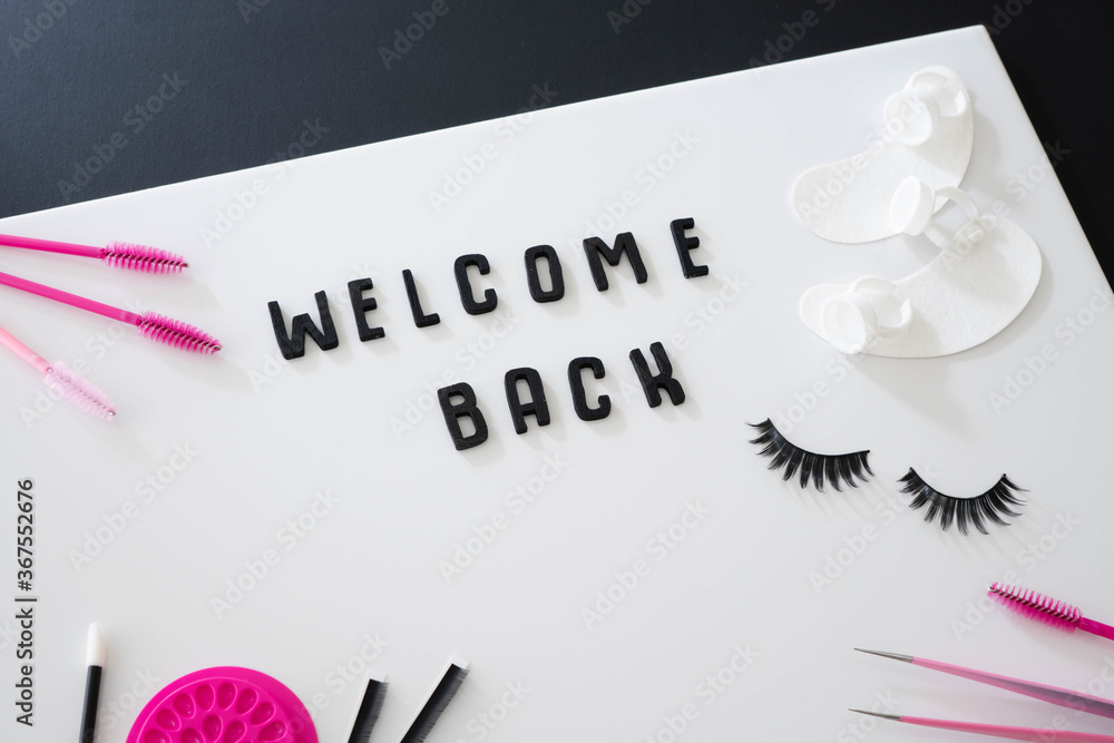 Black background with pink and black beauty salon treatment products ...