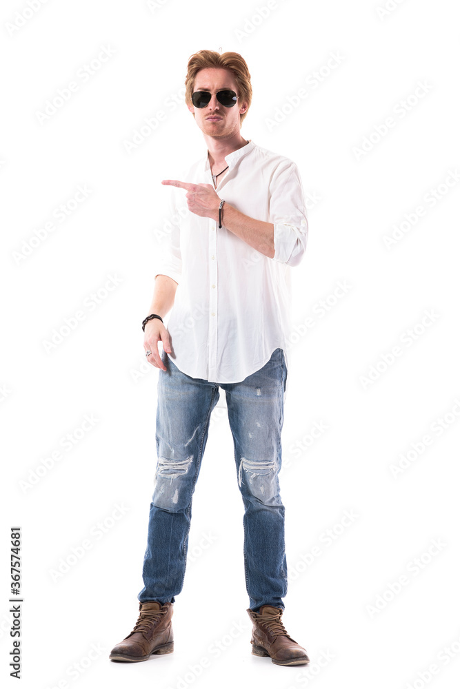 Displeased young strict man showing the doors ordering you to leave ...