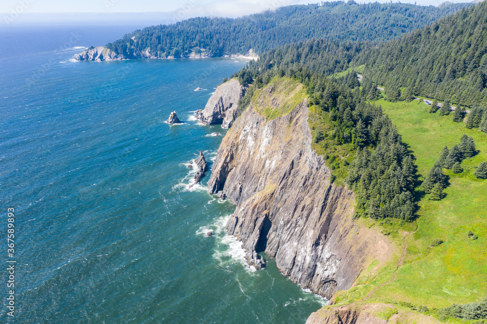 The cold Pacific Ocean meets the rugged coastline of Oregon just north ...