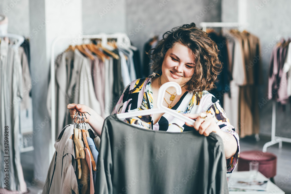 Plus Size Woman Choose Fashioned Dress in Store. Plus size women ...