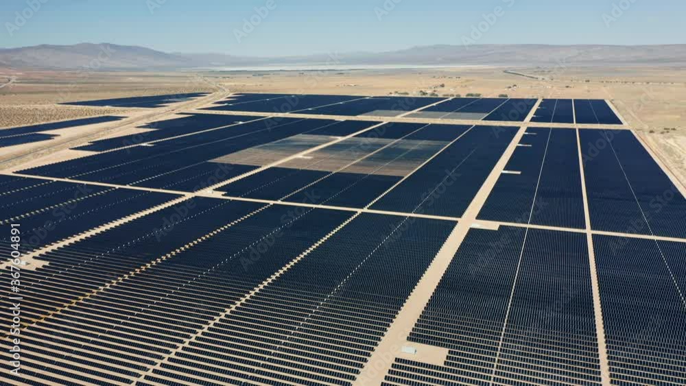 Cinematic 4K aerial view from drone of big solar power fields in the ...