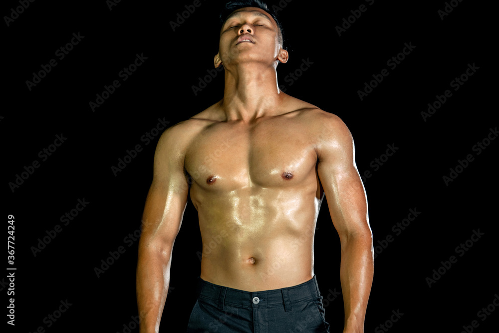 Muscle bodybuilder asia men posing muscle front on the black background ...