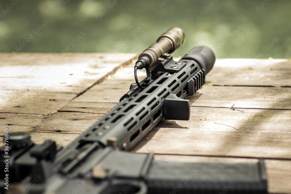 Military AR15 automatic assault rifle weapon with aim sight and ...