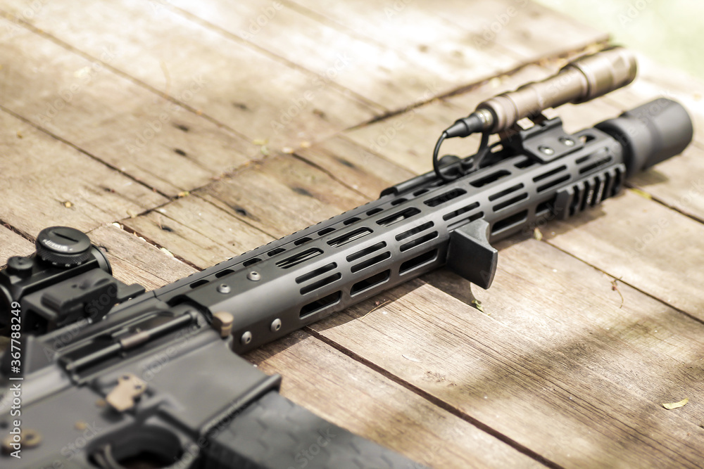 Military AR15 automatic assault rifle weapon with aim sight and ...