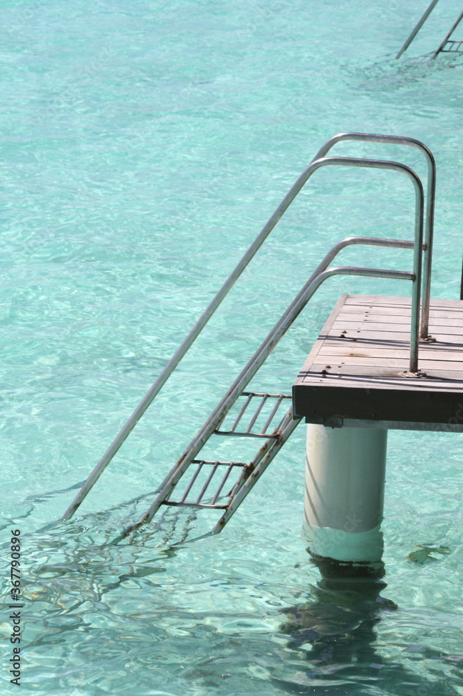 Beautiful isolated ladder of an overwater bungalow, down directly to ...