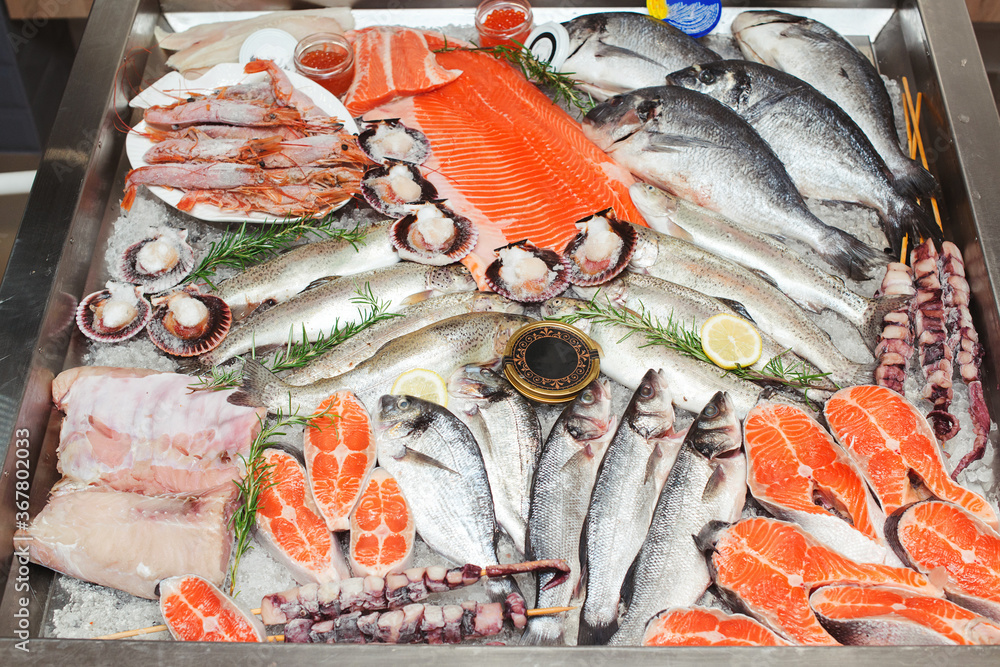 Showcase with chilled red fish in grocery store. Market place, showcase ...