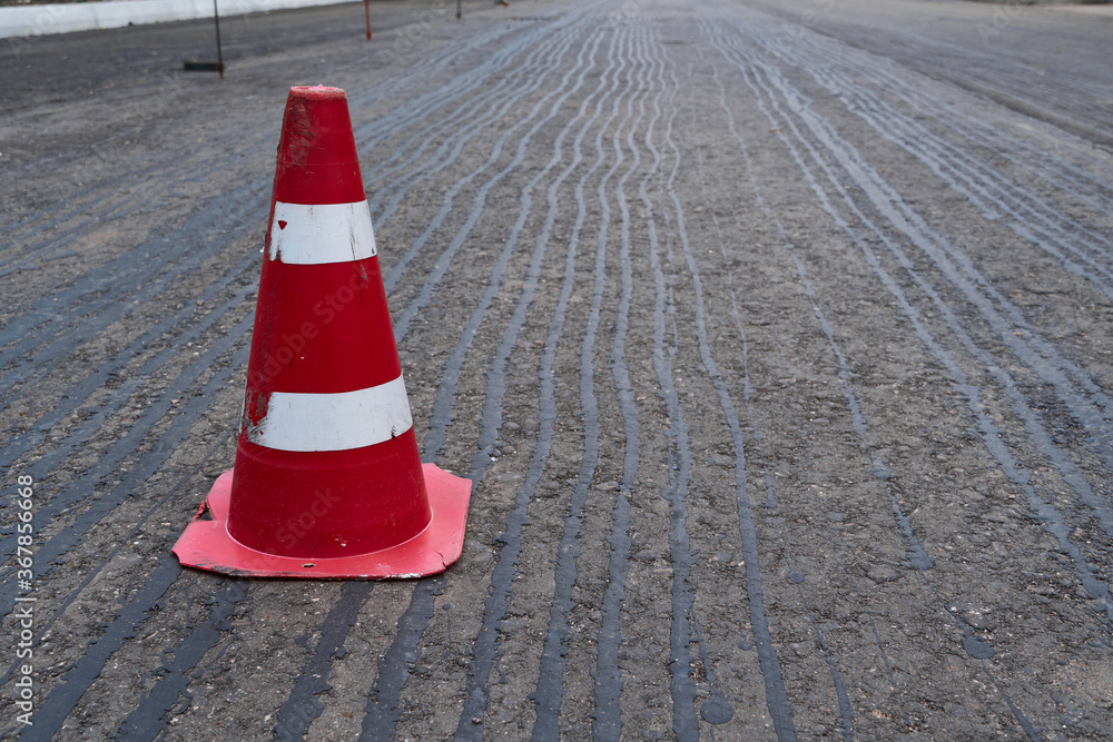 road construction or repair - laying a new layer of asphalt, marking ...