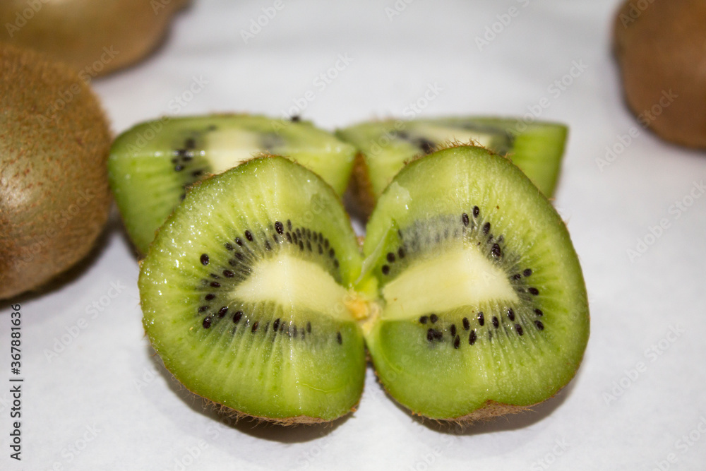 collection Whole kiwi fruit and his sliced segments isolated on white ...