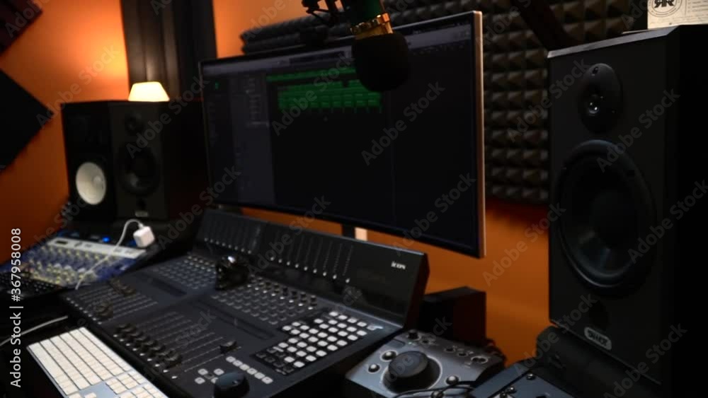 Moving slowly towards sound equipment: sound board, speakers, studio ...