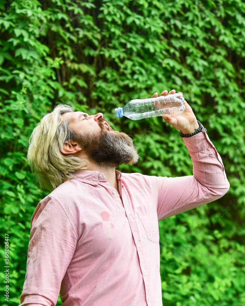Thirsty guy drinking bottled water. Healthy lifestyle. Hot day ...