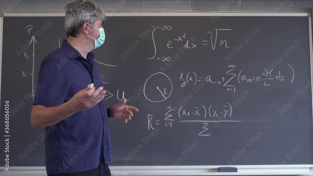 Maths Teacher wearing a face mask as a protection for the Coronavirus ...