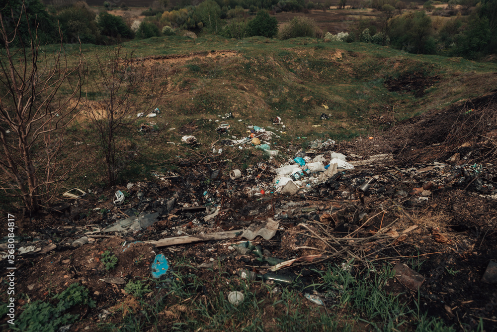 Large pile of garbage in the countryside. Pollution of nature with ...