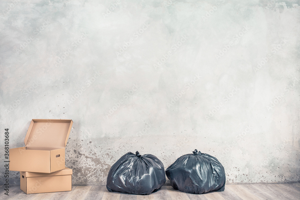Garbage bags full of trash and two cardboard boxes front vintage old ...