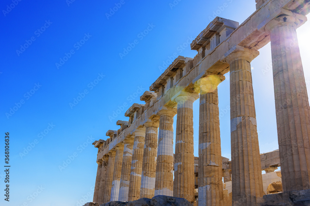 Columns of Parthenon in the rays of the morning sun. Restored, landmark temple ruins on ...