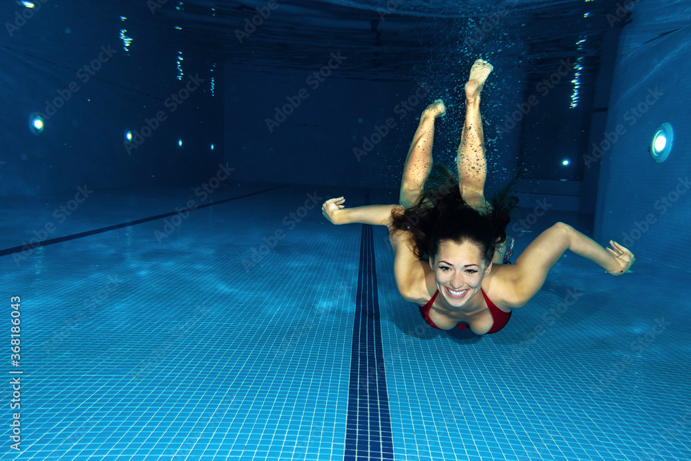 Beautiful woman diving in the swimming pool Stock Photo | Adobe Stock Beautiful woman diving in the swimming pool Stock Photo | Adobe Stock