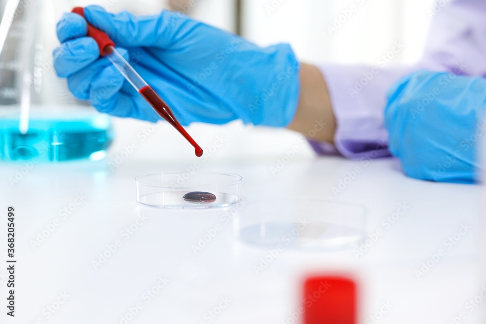 Scientist holding Coronavirus covid-19 infected blood sample tube DNA ...