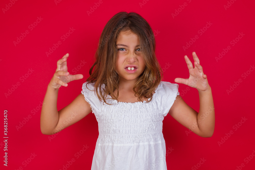 Little caucasian girl with blue eyes wearing white dress standing over ...