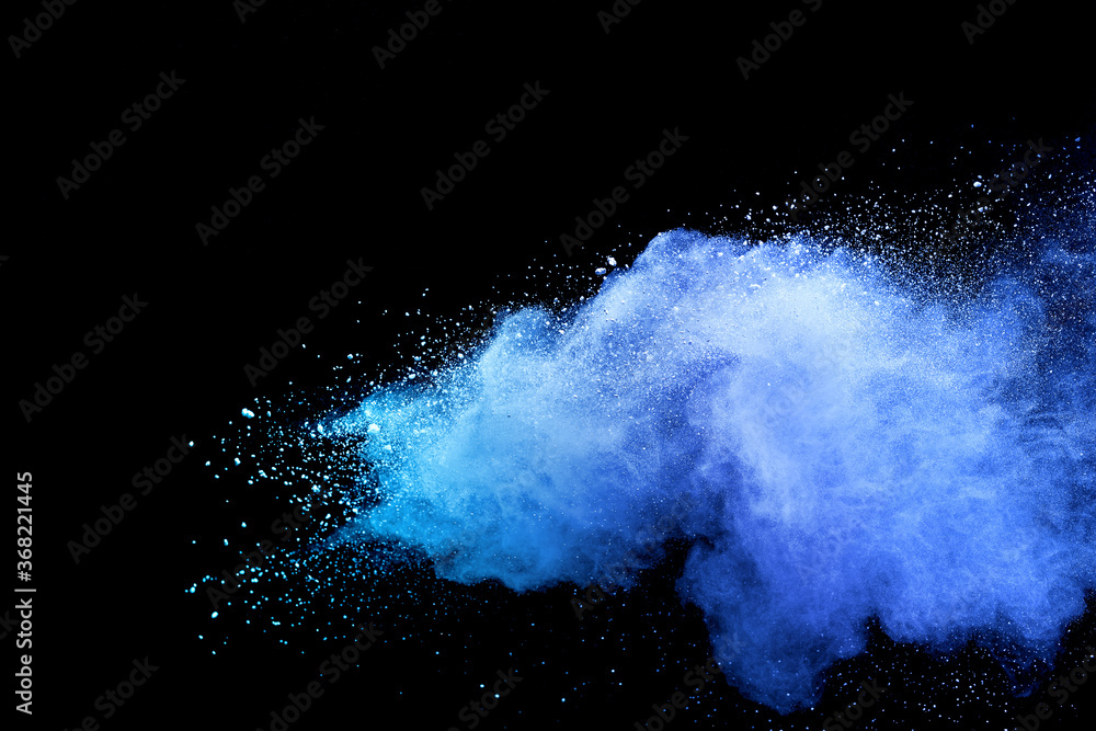 Closeup of blue dust particle splash isolated on black background ...