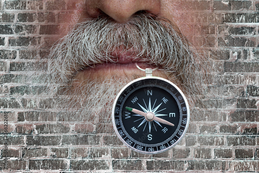 Abstract photo of part of face of man with compass in mouth against ...