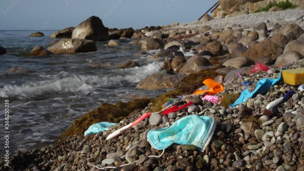 Video Stock Medical Covid -19 waste washed ashore. Disposable thrown ...