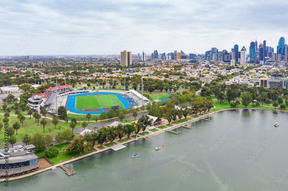 Aerial view of a sporting arena on the shores of a lake in front of a ...