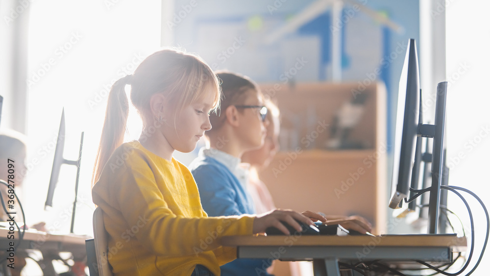 Elementary School Computer Science Classroom: Cute Little Girl Uses ...