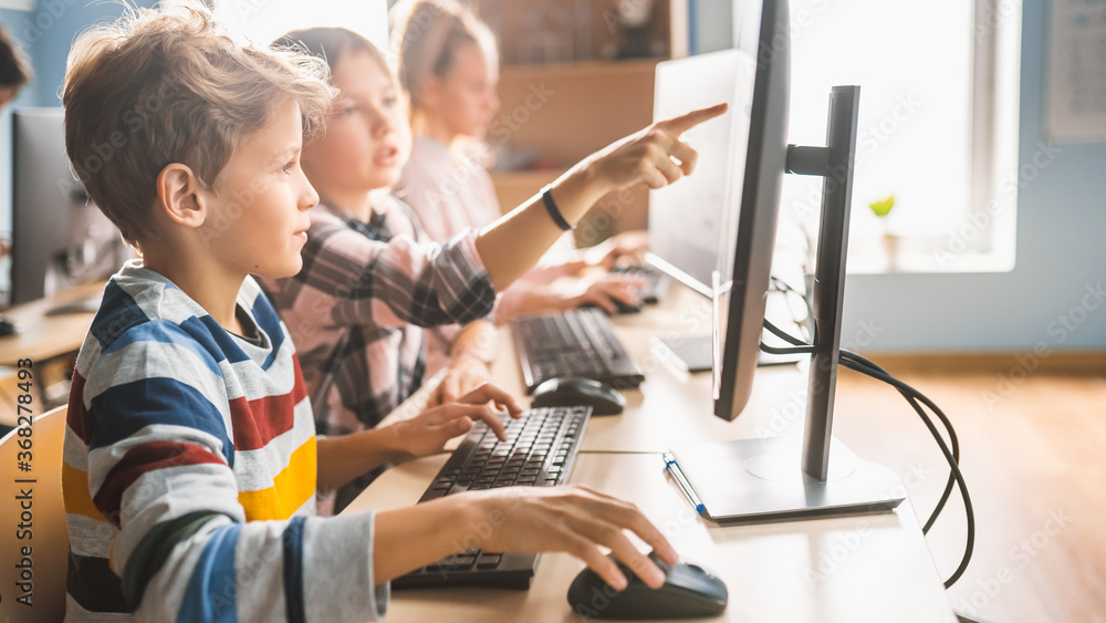 Elementary School Computer Science Classroom: Smart Girl Helps Boy ...