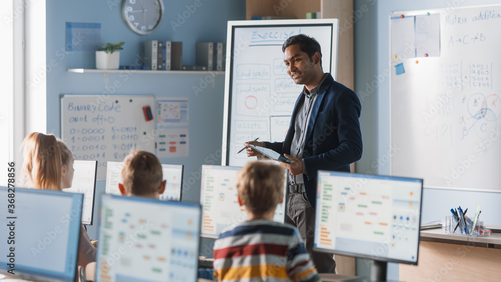 Elementary School Computer Science Class: Teacher Uses Digital Tablet ...