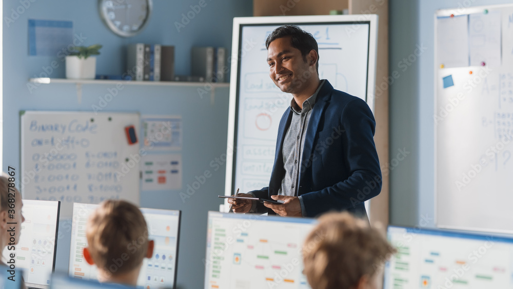 Elementary School Computer Science Class: Teacher Uses Digital Tablet ...