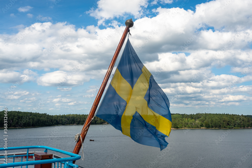 Swedish flag on board of a cruise ship. A beautiful Swedish flag is ...