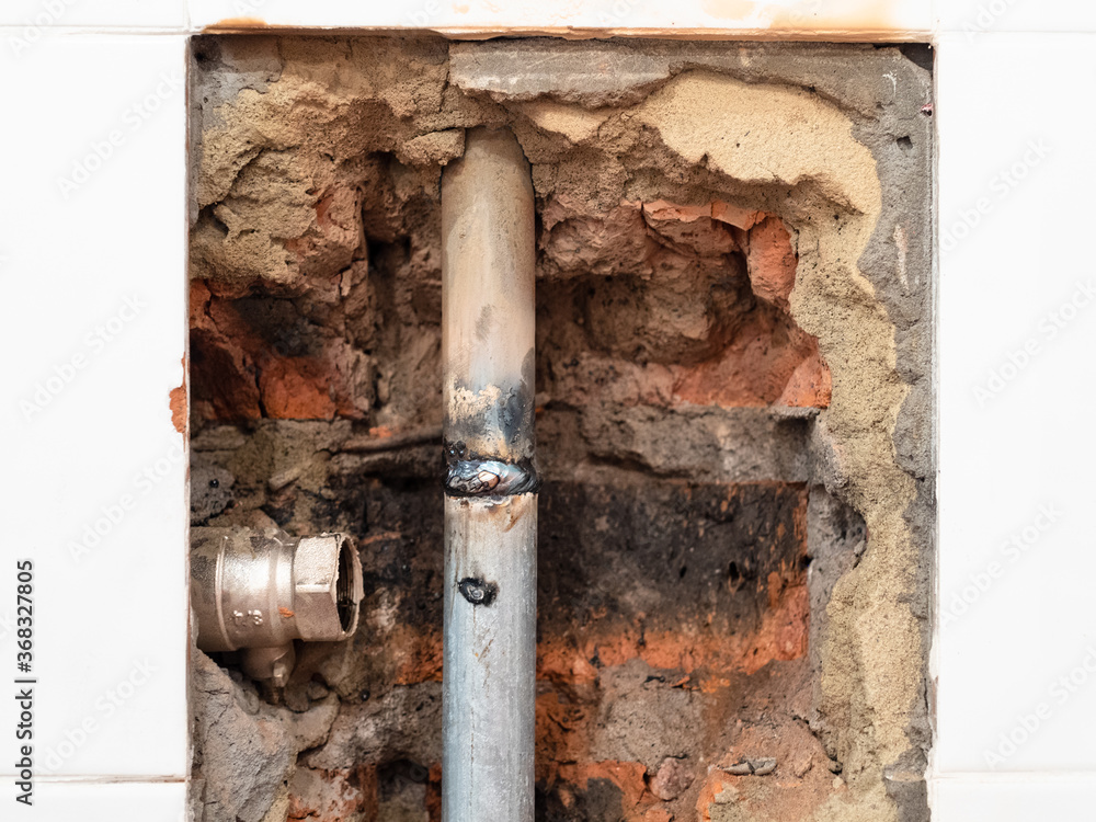 repairing of plumbing riser of heated towel rail at home - new pipe ...