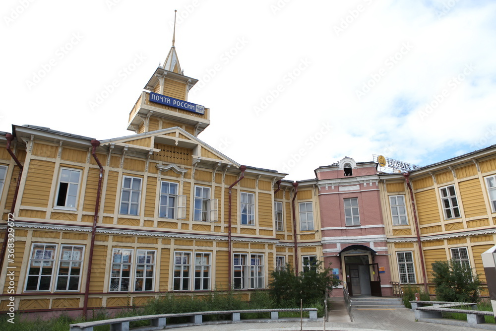 Old wooden building of mail and telegraph with carved windows in Butin ...