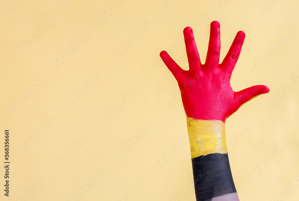 hand with paint A little girl's child's hand painted in the Belgian ...