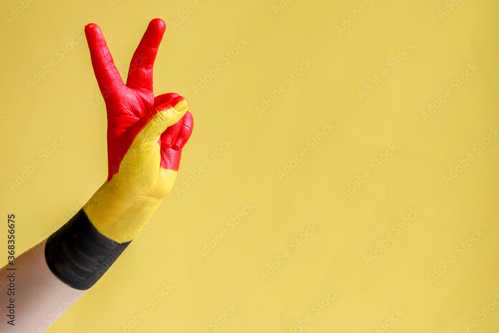 hand with paint A little girl's child's hand painted in the Belgian ...