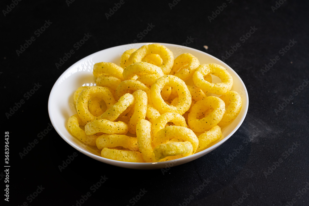 Corn rings with spices in a bowl Stock Photo | Adobe Stock