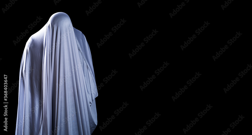 The man is in white clothes and shows a scary looking face on isolated ...