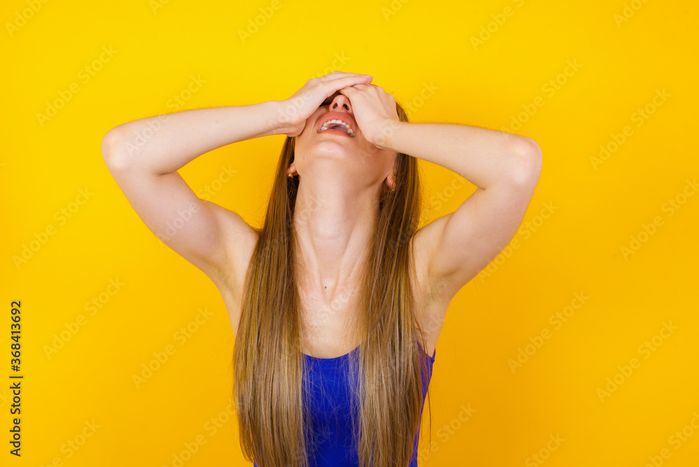 Shocked panic Caucasian girl dressed in stylish clothing holding hands ...