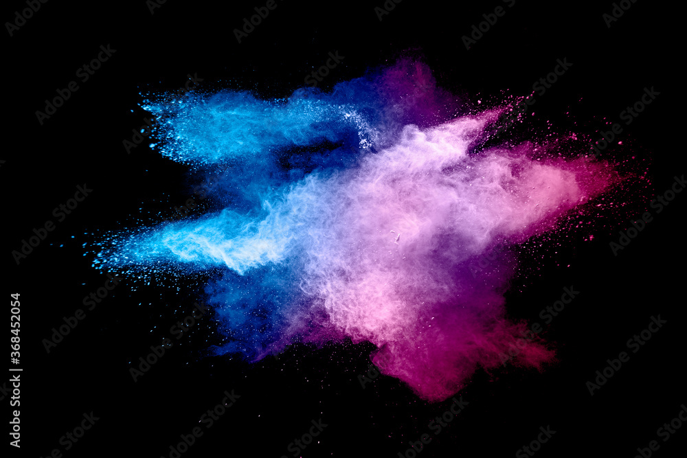 Abstract blue pink powder explosion on white background. Closeup of ...